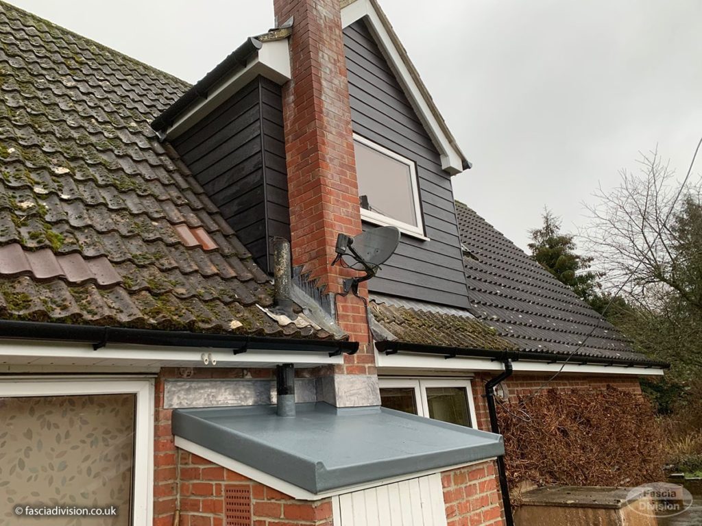 Midnight Black Hardieplank cladding, white fascias and soffits ...