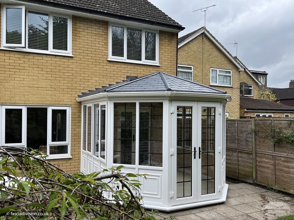 Conservatory renovation with warm roof, UPVC frames, and new windows ...