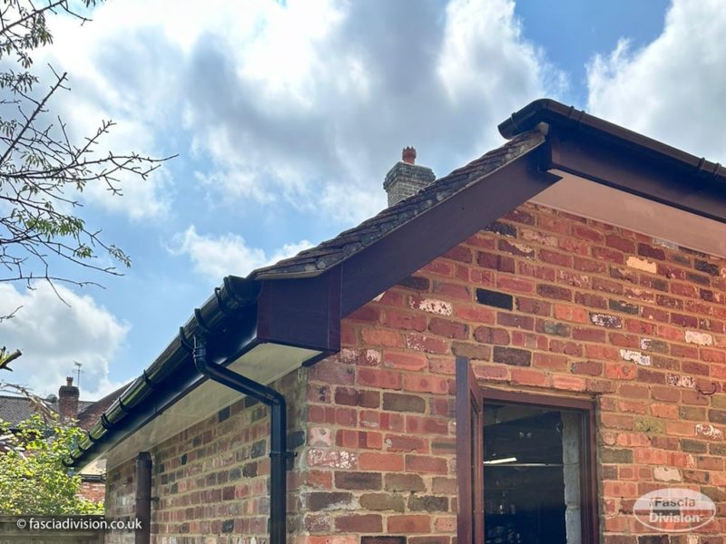 New rosewood fascia, white soffits and black guttering in Caterham